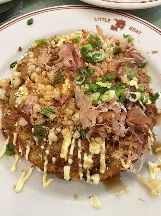 Japan meets Chicago in this Okonomiyaki—a savory pancake topped with dancing bonito flakes and drizzles that make every bite a different adventure.