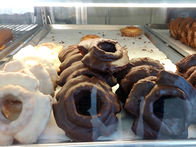 Old-fashioned donuts with that signature crackly exterior—the vinyl records of the pastry world, appreciated by true connoisseurs for their authentic character.