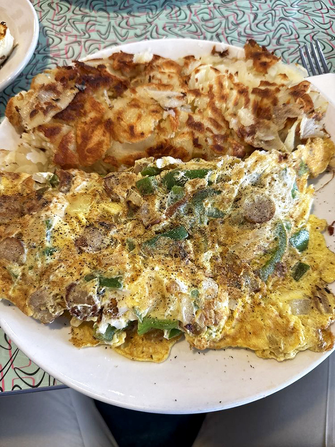 This isn't just an omelet—it's a masterclass in morning architecture, with each ingredient playing its perfect role in the breakfast symphony.