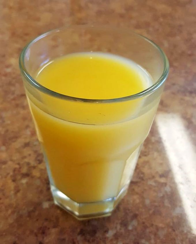 Fresh-squeezed orange juice that actually tastes like oranges—what a concept! This liquid sunshine is the perfect companion to Al's hearty breakfast offerings.
