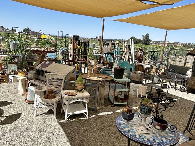 Outdoor furniture basks under shade sails, waiting for someone to rescue it from its al fresco retirement.