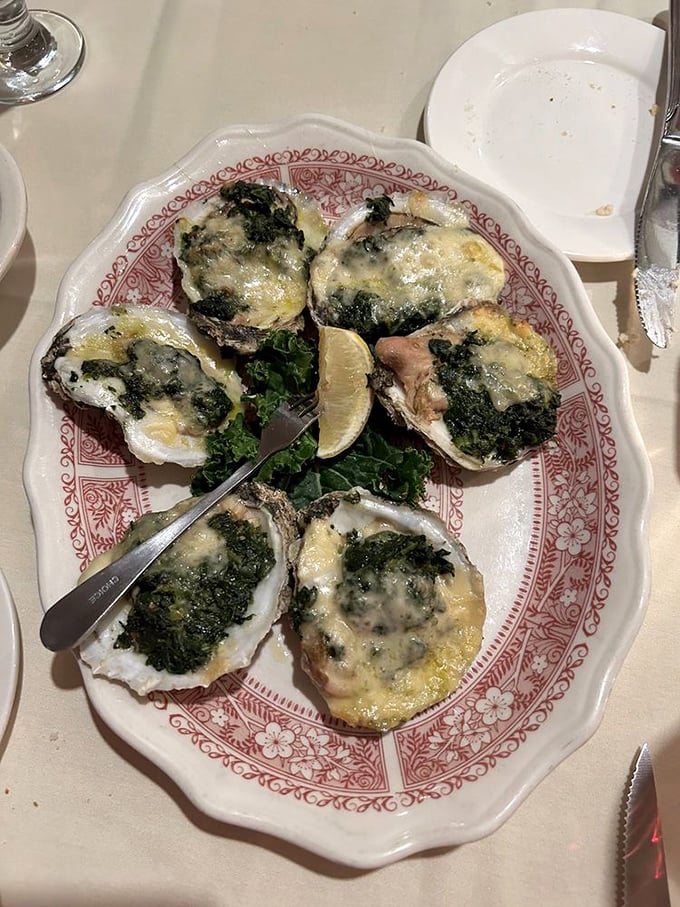 These aren't just oysters—they're little boats of happiness, sailing on a sea of spinach and cheese toward your eager taste buds. 