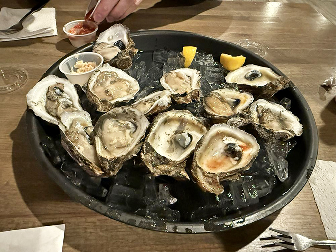 Fresh oysters on ice, waiting for their moment to shine – nature's perfect little flavor bombs.