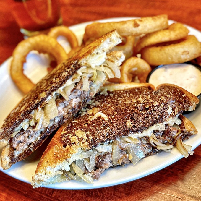 The patty melt—that brilliant marriage of burger and grilled cheese that proves sometimes the best innovations happened decades ago.