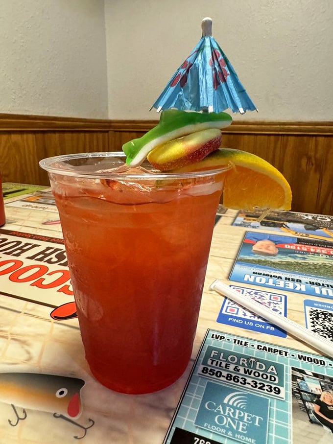 That colorful cocktail isn't just a drink; it's a vacation in a cup. Complete with tiny umbrella – because why should your beverage dress more casually than you?