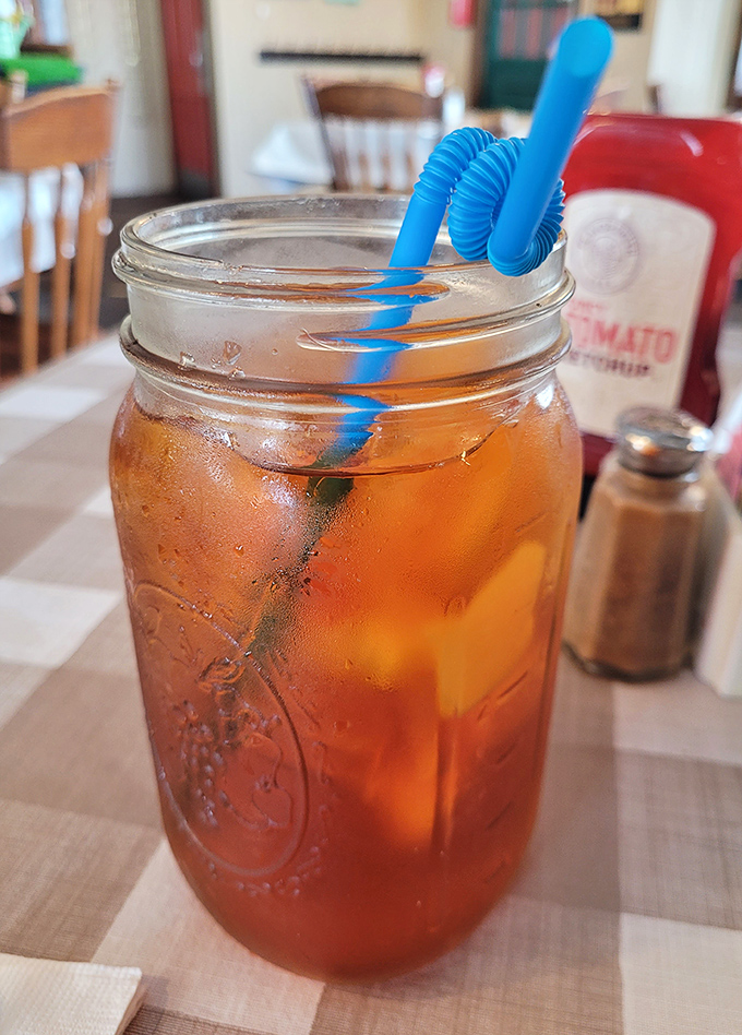 Mason jar iced tea—served with enough sugar to power a kindergarten class and the kind of honest simplicity that makes hipster cafes weep.
