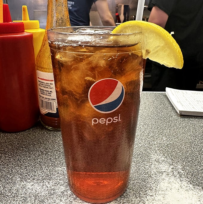 In the soda wars, this Pepsi with lemon comes dressed for battle—cold, crisp, and ready to wash down burger perfection.