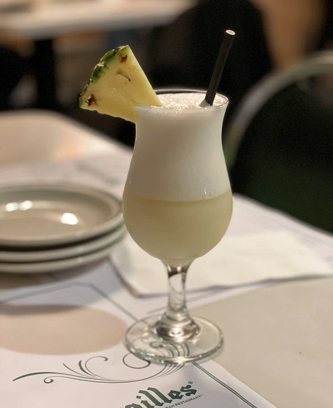 A piña colada that transports you straight to vacation mode – creamy, tropical, and garnished with a slice of paradise.