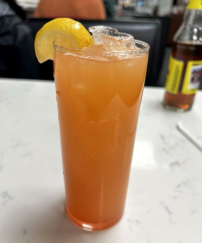 That tall glass of pineapple crush isn't just a beverage—it's sweet, tangy salvation after the glorious salt bomb of a proper cheesesteak.