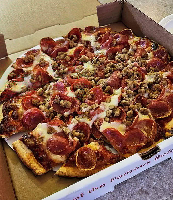 Pizza that doesn't try to be artisanal or authentic Italian – just deliciously American with a generous blanket of pepperoni and sausage.
