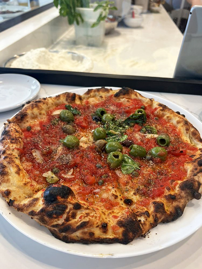 Anchovies and capers bring the Mediterranean Sea to Los Angeles in this Napoletana pizza that would make Neptune himself weep with joy.