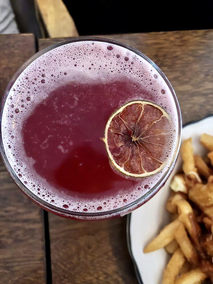 This ruby-hued refresher with its dried citrus garnish offers a moment of elegant respite between trips to the buffet line.