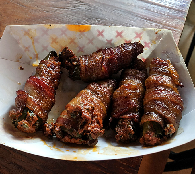 Bacon-wrapped jalapeño poppers—where heat meets sweet meets meat. The holy trinity of flavor bombs that disappear faster than you'd admit.