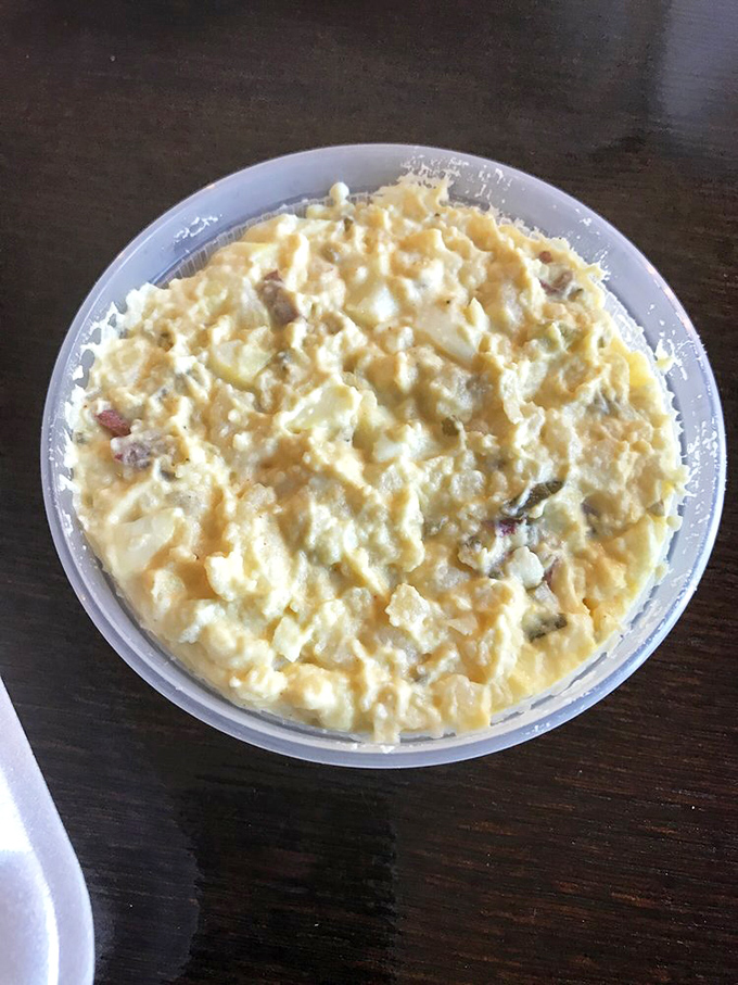 Potato salad that could start family feuds or end wars, depending on the day. Creamy, chunky perfection that demands to be shared.