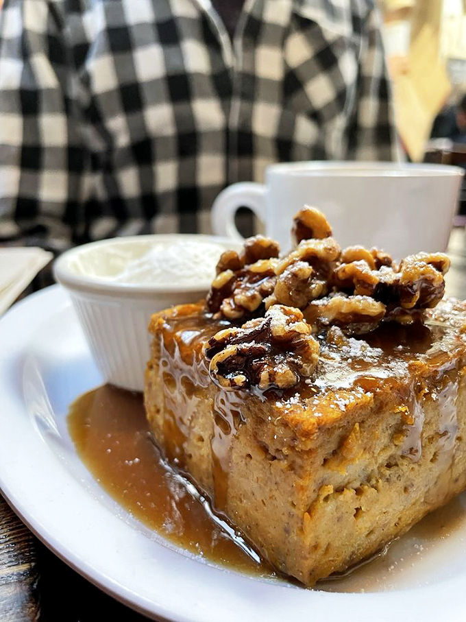 This isn't just bread pudding – it's an architectural masterpiece of comfort food, topped with pecans that add the perfect crunch factor.
