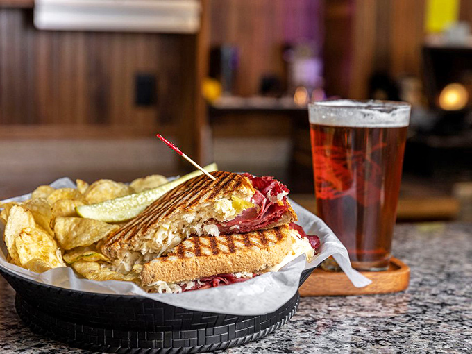 The Reuben sandwich and cold beer—a Midwest power couple that never disappoints. That grill mark perfection speaks volumes. 