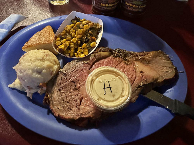 This ribeye steak, sporting that beautiful pink center, proves Grumpy's isn't just about low-and-slow—they can handle hot-and-fast with equal finesse.