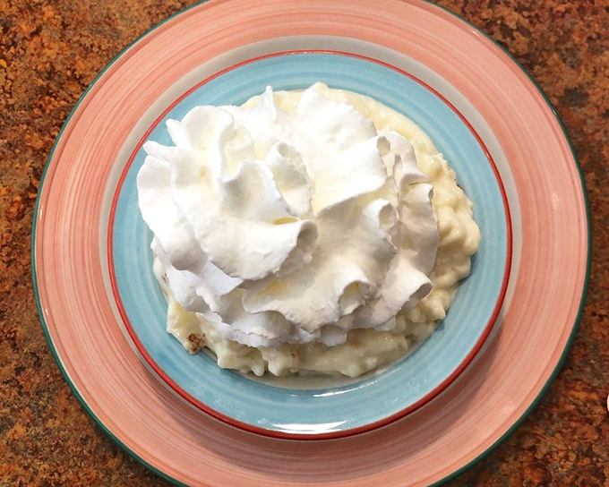 Rice pudding crowned with whipped cream—the dessert equivalent of a warm hug after a long day.