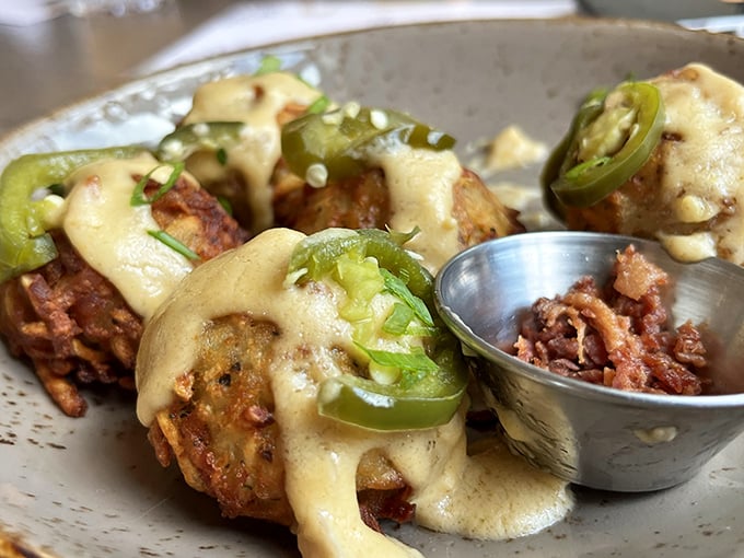 Roasted cauliflower that's having an identity crisis as bar food—and winning. Those jalapeños aren't just garnish; they're exclamation points.