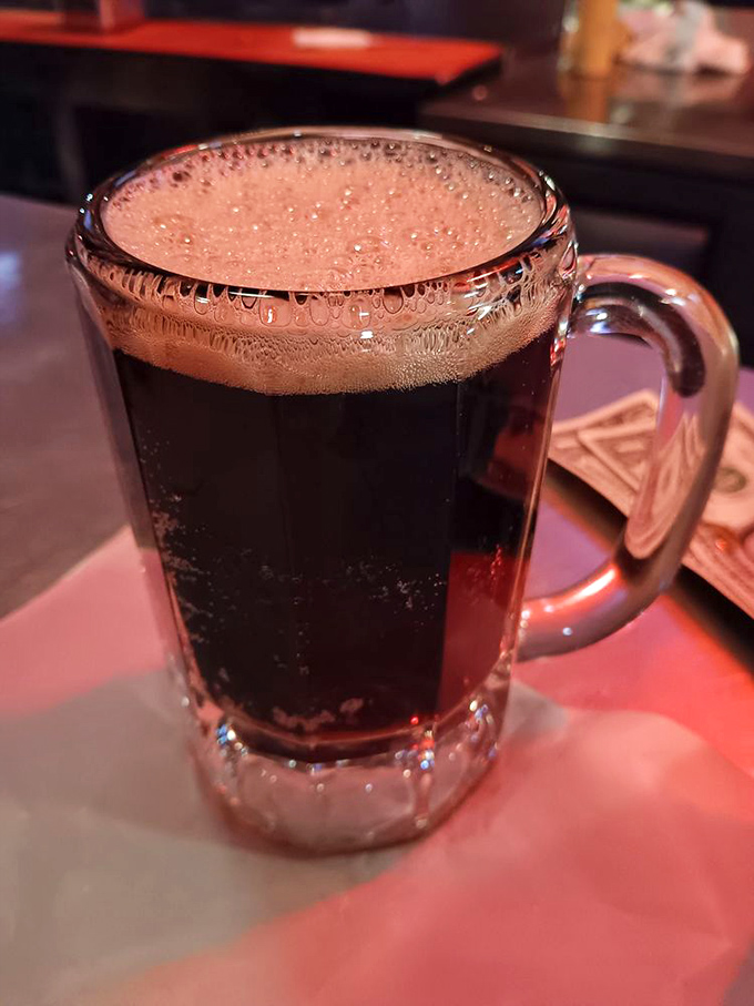 Root beer served in the same iconic schooner as the regular brews—because at Joe Jost's, even the non-alcoholic options deserve the royal treatment.