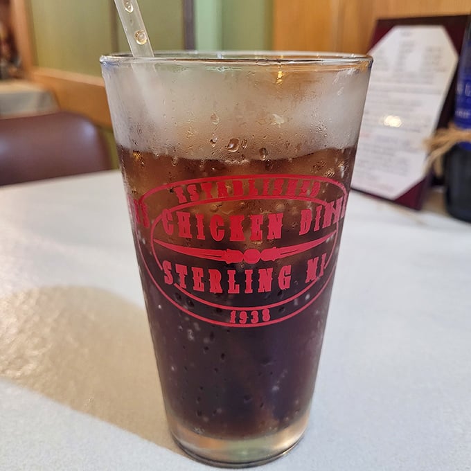 Not just any root beer—a frosty mug of nostalgia with the restaurant's logo proudly displayed. Sip slowly and contemplate the meaning of carbonated bliss.