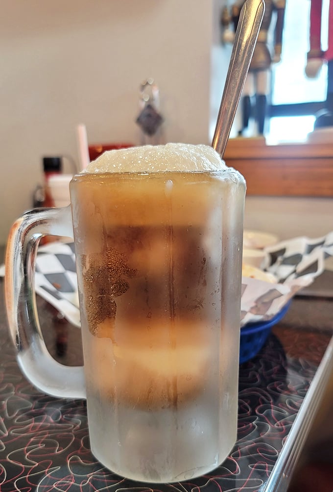 A frosty root beer float in a mug so cold it sweats – summer in a glass, regardless of what season it actually is outside.