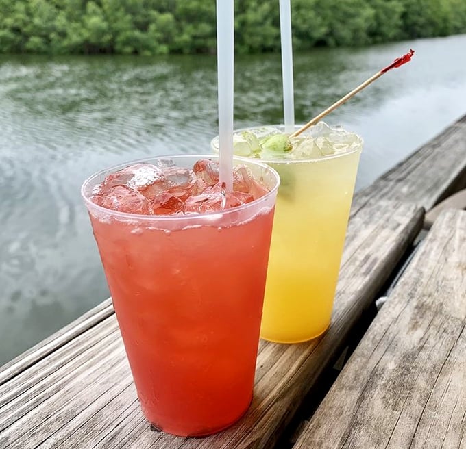 Colorful drinks that taste like vacation feel even more magical when sipped at the water's edge—liquid postcards from paradise.