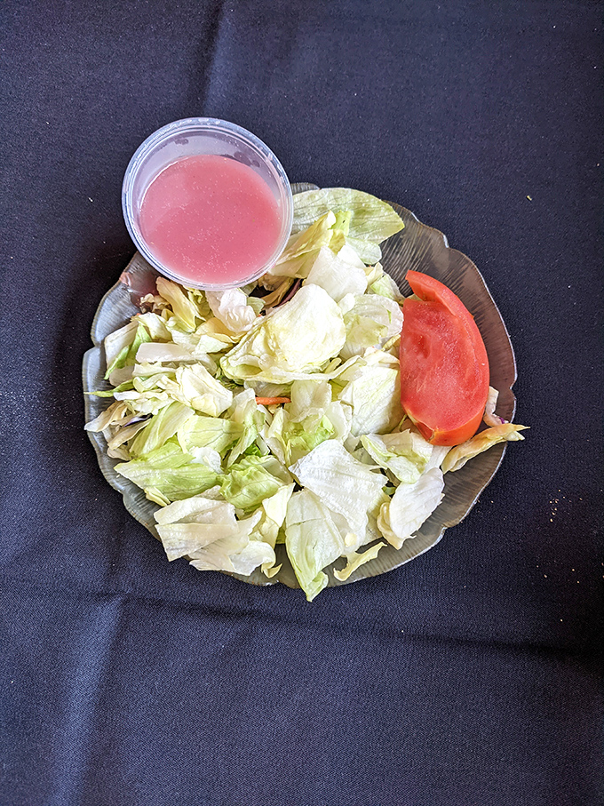 A simple salad that knows its role—the palate-cleansing opening act before the headliner steak takes center stage.