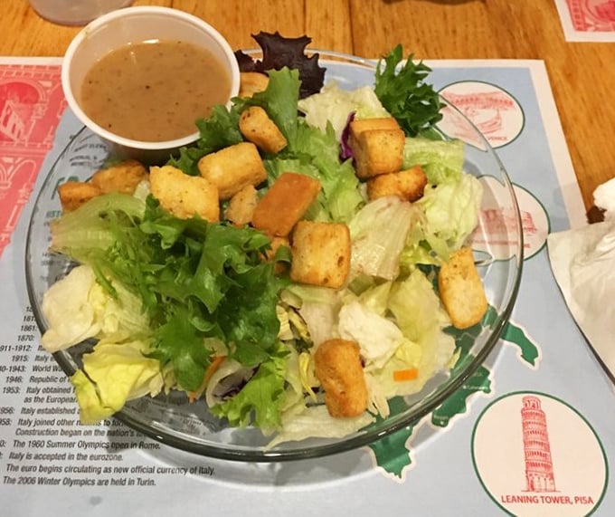 Even the salad gets special treatment—crisp greens, golden croutons, and dressing that doesn't come from a bottle with a ranch cowboy on it.
