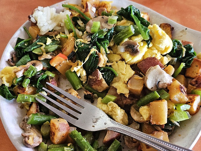 A scramble that proves vegetables can party too—colorful, vibrant, and making you feel virtuous while still being delicious.