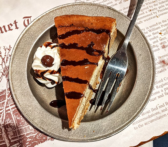 A slice of chocolate cheesecake drizzled with caramel that could make even the most dedicated dieter throw willpower to the wind.