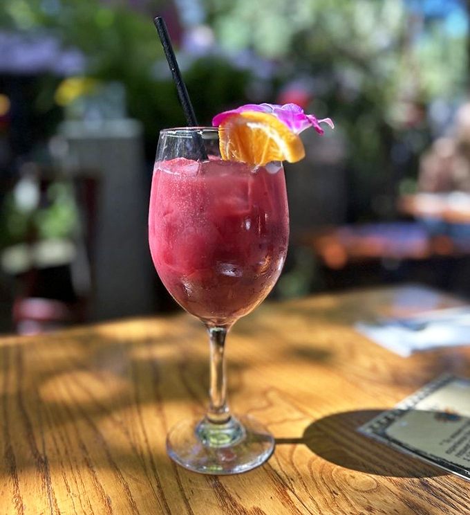 A sangria so photogenic it could have its own Instagram account, garnished with fresh fruit and flowers like it's headed to the Met Gala.