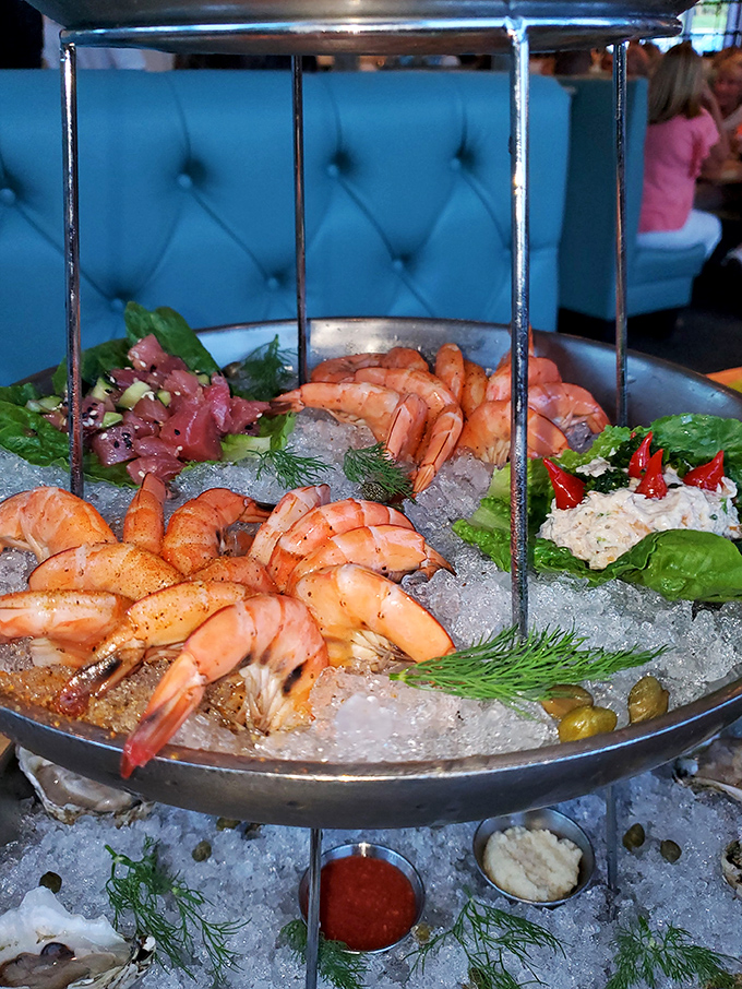 A seafood tower that's basically an edible sculpture. Plump shrimp, fresh tuna, and accompaniments arranged so beautifully you almost feel guilty dismantling it. Almost.