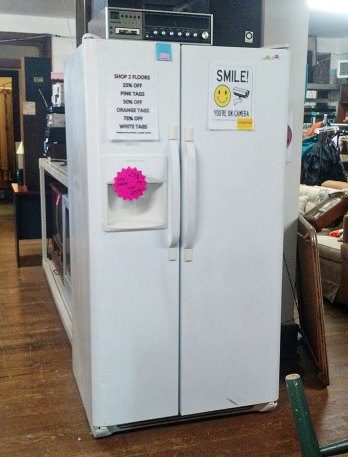 The refrigerator section: where color-coded discount tags reveal how desperately they want to free up floor space for tomorrow's domestic castoffs.