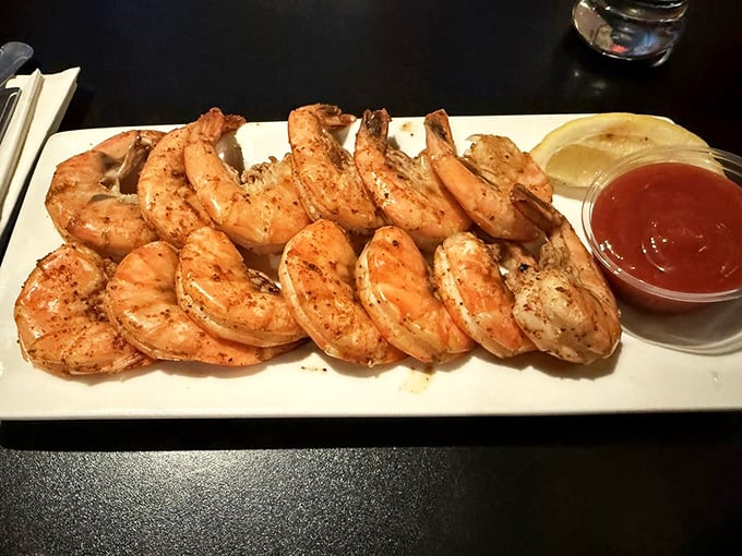 These shrimp aren't just grilled—they're living their best life, lined up like sunbathers on a plate-sized beach.