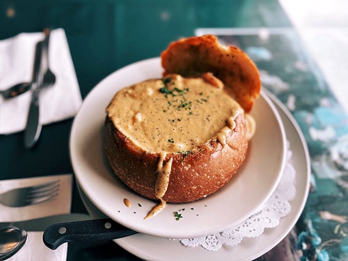 This bread bowl of chowder isn't just soup—it's an interactive culinary experience where the container becomes part of the meal's grand finale.