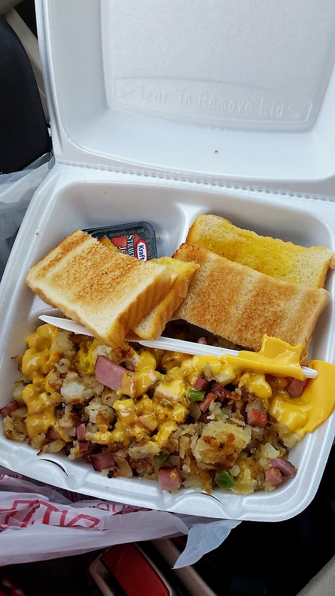 Breakfast heaven in a styrofoam container. Those hash browns with melted cheese and ham could cure any ailment known to mankind.