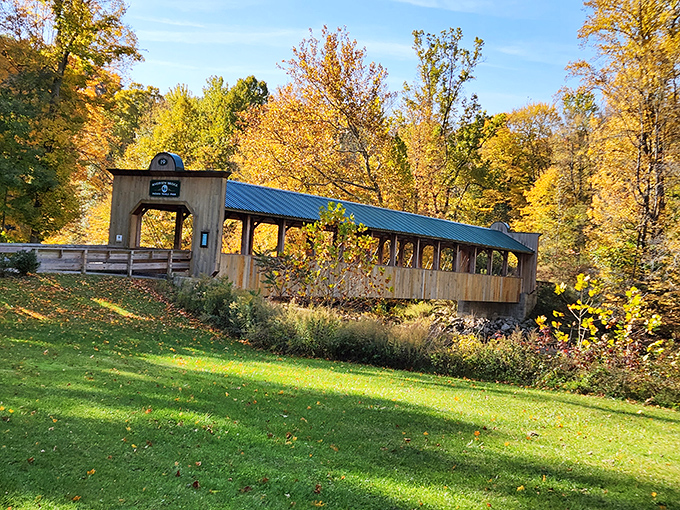 This covered bridge isn't just crossing water—it's spanning generations, connecting modern visitors to craftsmanship that predates their smartphones.