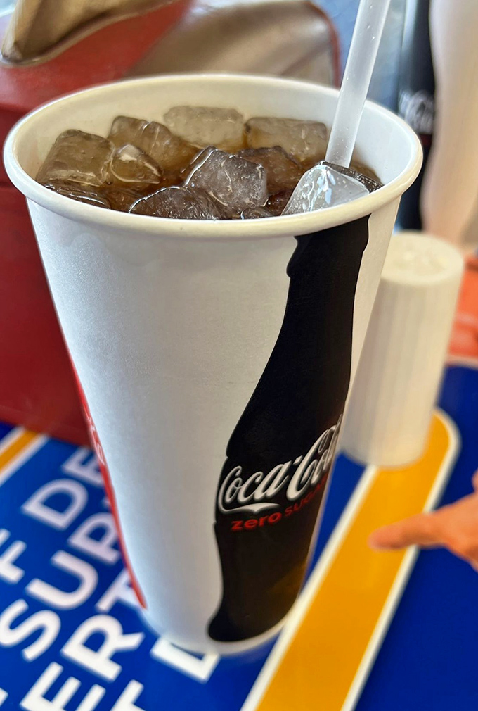 Even the soda feels nostalgic here—ice-cold Coca-Cola in a proper paper cup. Some pleasures remain blissfully unchanged by time.