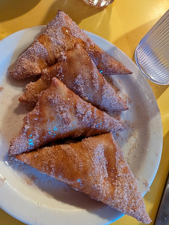 Sopapillas dusted with cinnamon sugar – little pillows of fried dough that make you question why you ever wasted time on lesser desserts.