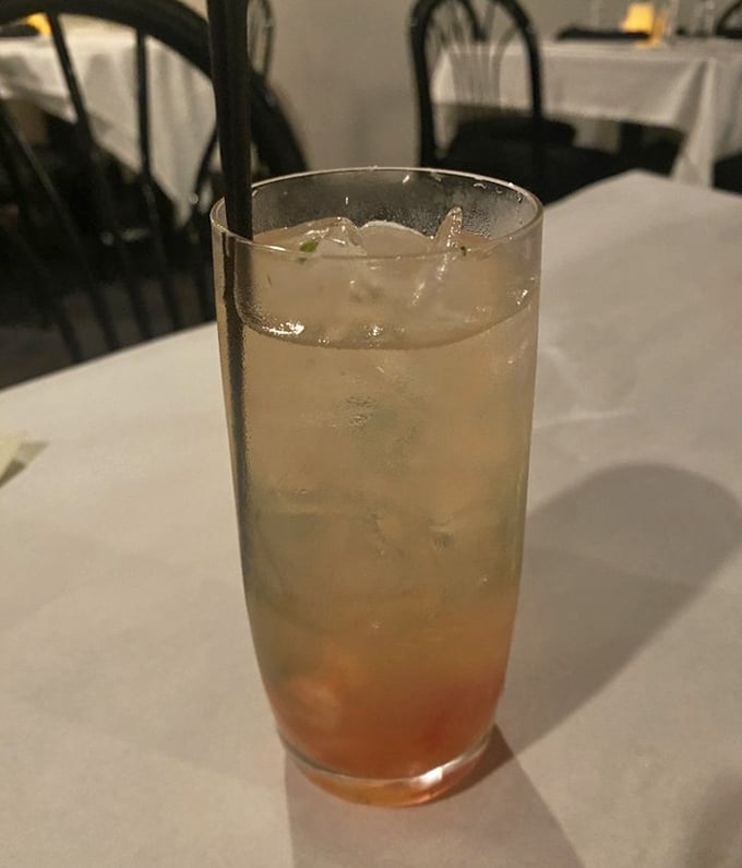 A strawberry basil lemonade that's like summer in a glass—refreshing enough to make you momentarily forget you just ordered three courses.
