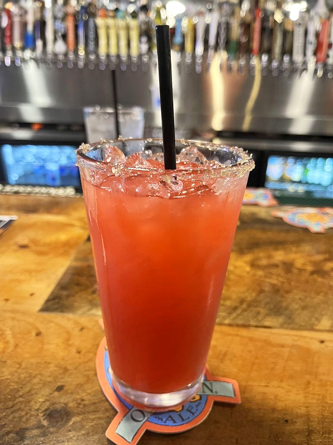 This isn't just a strawberry margarita – it's summer in a salt-rimmed glass, the perfect counterpoint to a rich, indulgent burger feast.