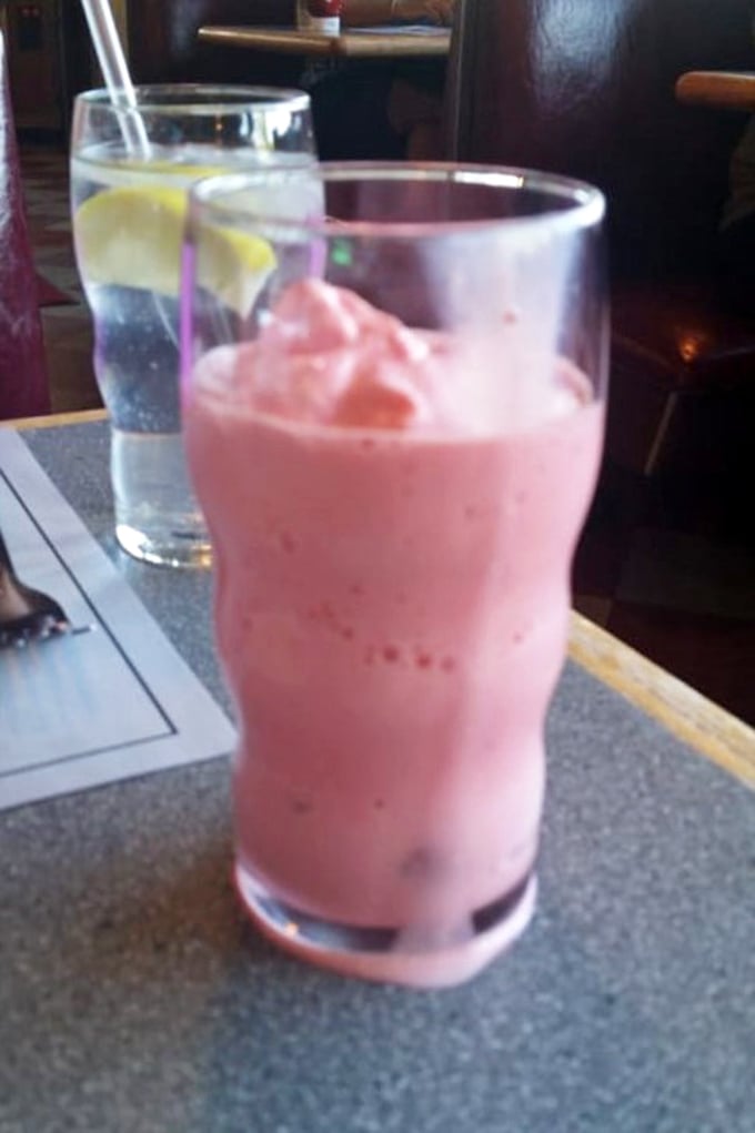 That strawberry milkshake isn't just pink—it's a commitment to happiness. Thick enough for a spoon, but worth the straw struggle.