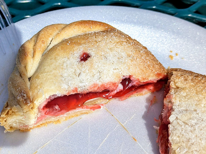 Sweet meets tart in this strawberry pasty – the crimson filling peeking through a sugar-dusted crust. Dessert or breakfast? At Muldoons, no one's judging either way.