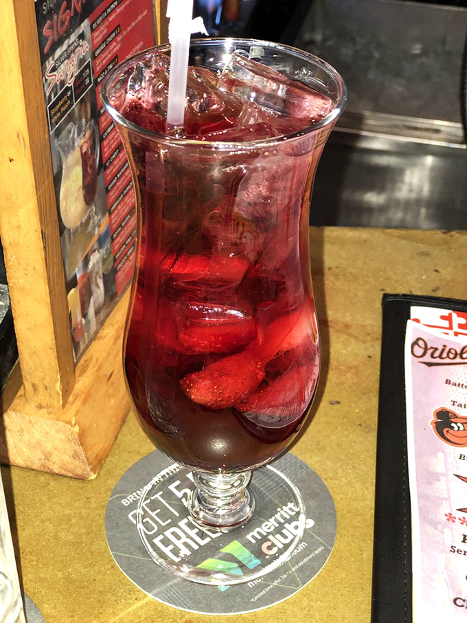 Ruby-red sangria that's both refreshing and dangerous—like a summer romance that sneaks up on you with unexpected sweetness.