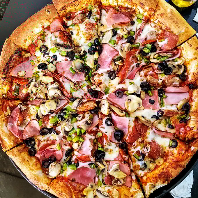 Pizza perfection in circular form! This loaded supreme pie proves that sometimes more is more—especially when it comes to toppings.