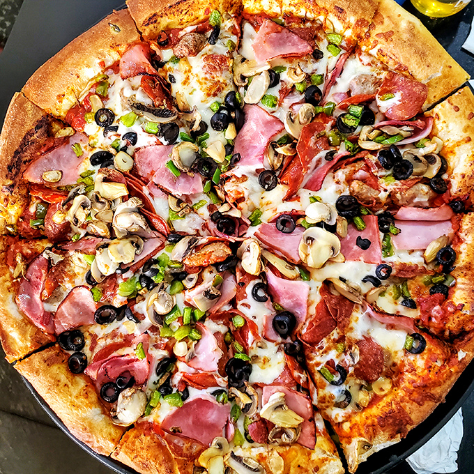 Pizza perfection in circular form! This loaded supreme pie proves that sometimes more is more—especially when it comes to toppings.