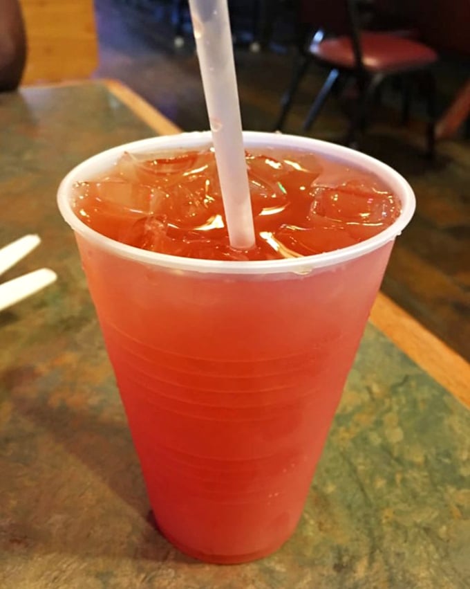 The mysterious Swamp Juice cocktail glows with tropical promise. Like Florida in a cup—sweet, punchy, and not afraid of color.