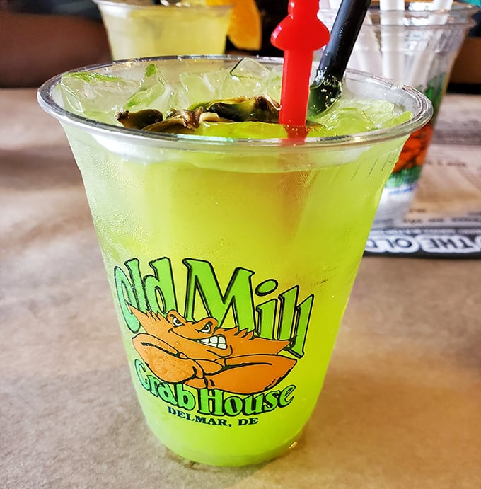 The Swamp Watermelon Margarita glows with promise. Like a tropical vacation in a glass, complete with a souvenir cup.