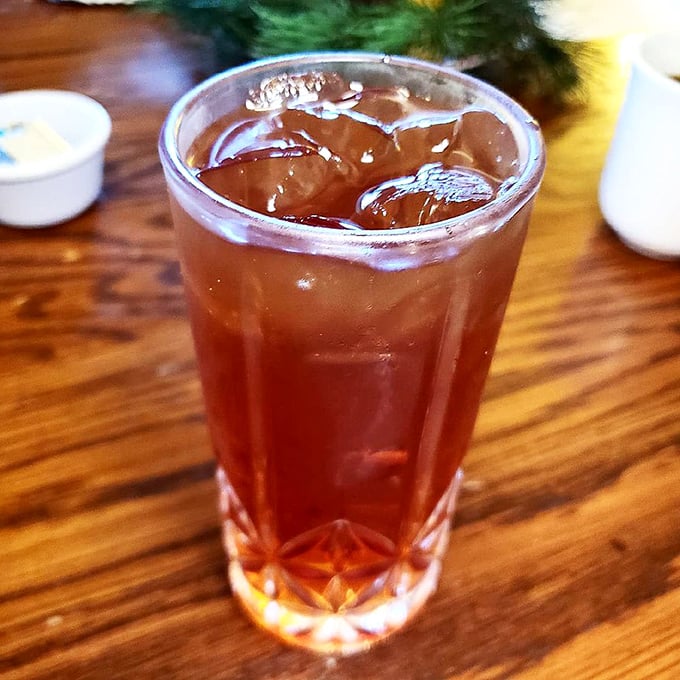 Sweet tea so perfectly brewed and sugared it practically qualifies as a dessert—served in a glass that catches the light like liquid amber.